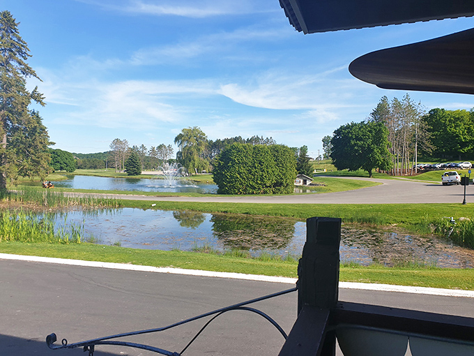 A serene pond view offers a moment of tranquility after the indoor aquatic chaos, reminding visitors that Wisconsin's natural beauty awaits outside.