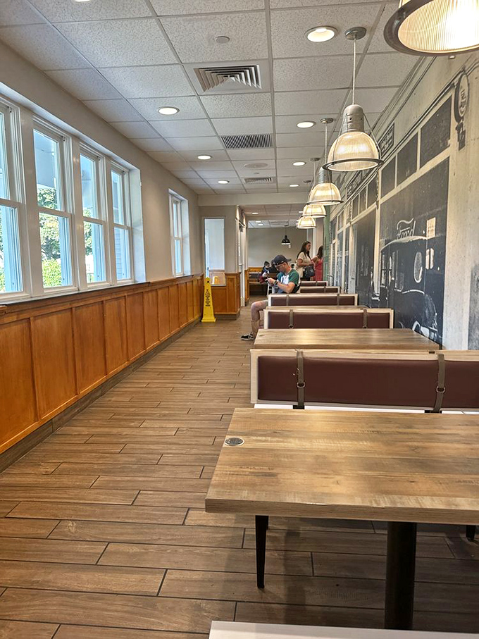 Cozy corner seating: Wood paneling and warm lighting create intimate dining spaces unlike any other McDonald's in the world. 