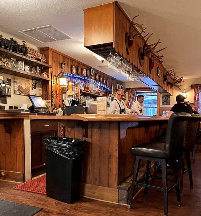 Another angle of the bar reveals more of its character &ndash; reclaimed wood panels tell stories while you sip something spectacular.