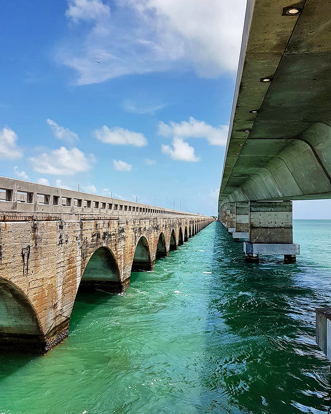 Engineering marvel: The Seven Mile Bridge connects the Keys like a concrete lifeline, spanning impossible distances over jewel-toned waters.