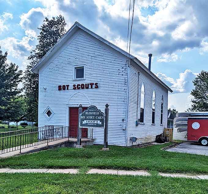 The white clapboard Boy Scout Cabin stands as a testament to Blissfield's commitment to community values and youth development.