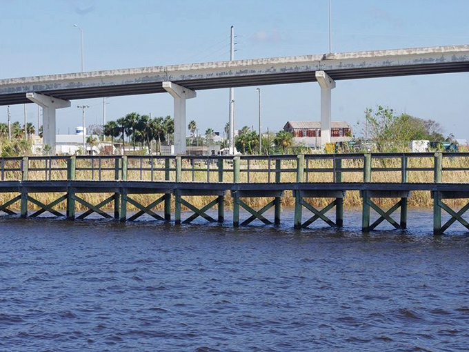 Weathered wooden docks stretch into calm waters, inviting visitors to pause and appreciate the rhythmic tranquility of coastal life.