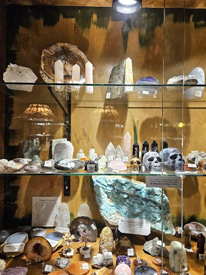 This cabinet showcases everything from crystal points to carved skulls, with each shelf offering new treasures for the discerning collector.