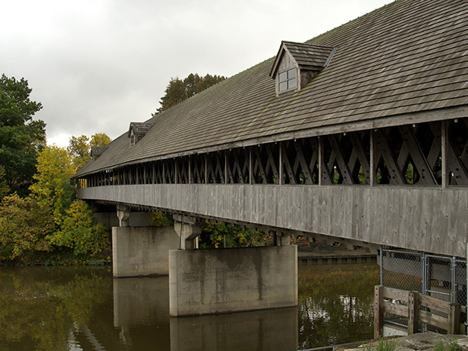 The weathered exterior tells stories of countless Michigan seasons, wearing its age with the dignity of a structure built to last generations.