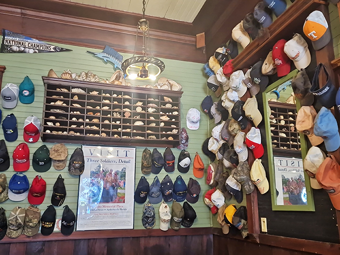 Every inch of wall space tells a story &ndash; fishing trophies, vintage photos, and hundreds of caps create a museum of coastal living.