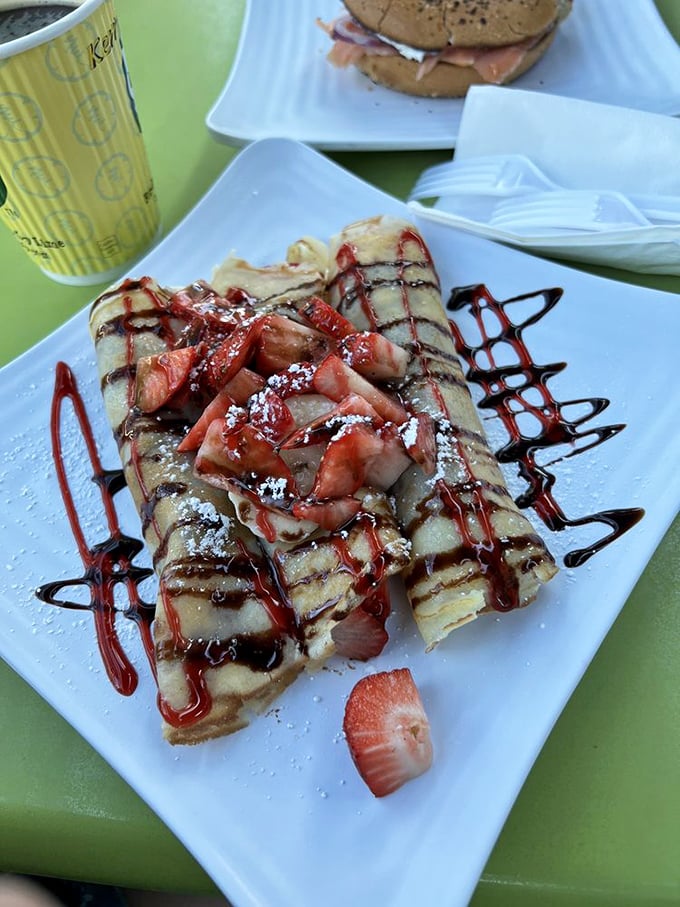 Crepes folded around fresh strawberries and drizzled with chocolate &ndash; like edible love letters from France to Florida.