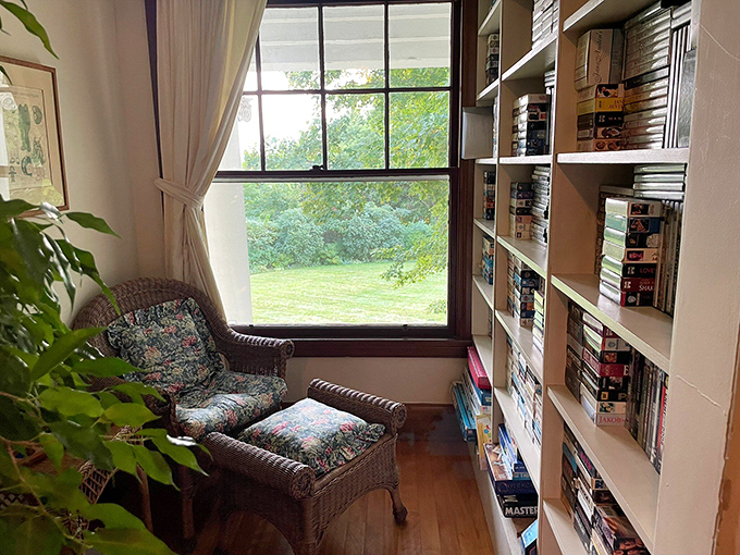 A reader's paradise: The cozy library nook offers a quiet retreat with garden views and well-stocked bookshelves.