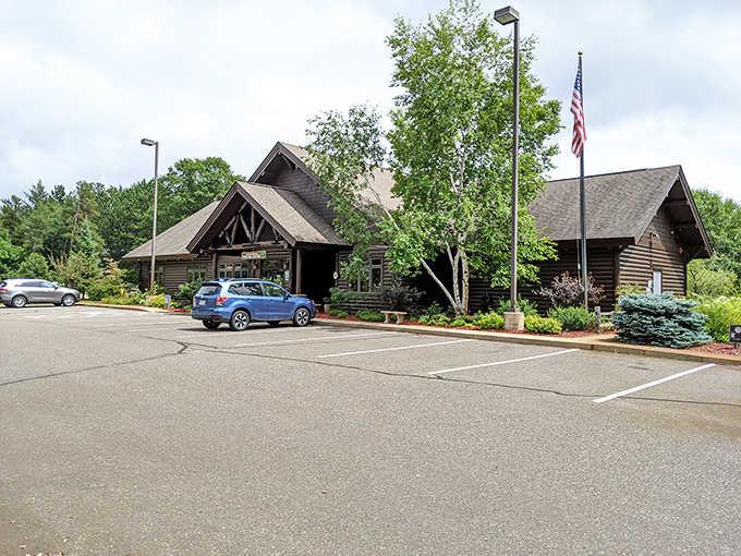 The parking area welcomes road-weary travelers with the promise of historic charm and modern flavors – plus that vintage Jeep is pretty cool.