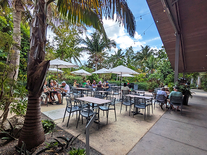 The outdoor patio offers al fresco dining under swaying palms, where lunch comes with a soundtrack of birdsong and gentle breezes.