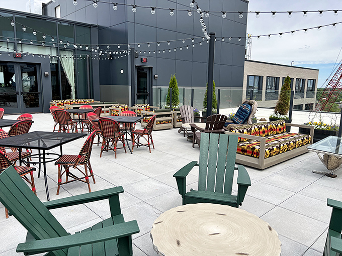 The rooftop patio offers Adirondack chairs perfect for sunset watching, stargazing, or simply soaking in the college town energy below.