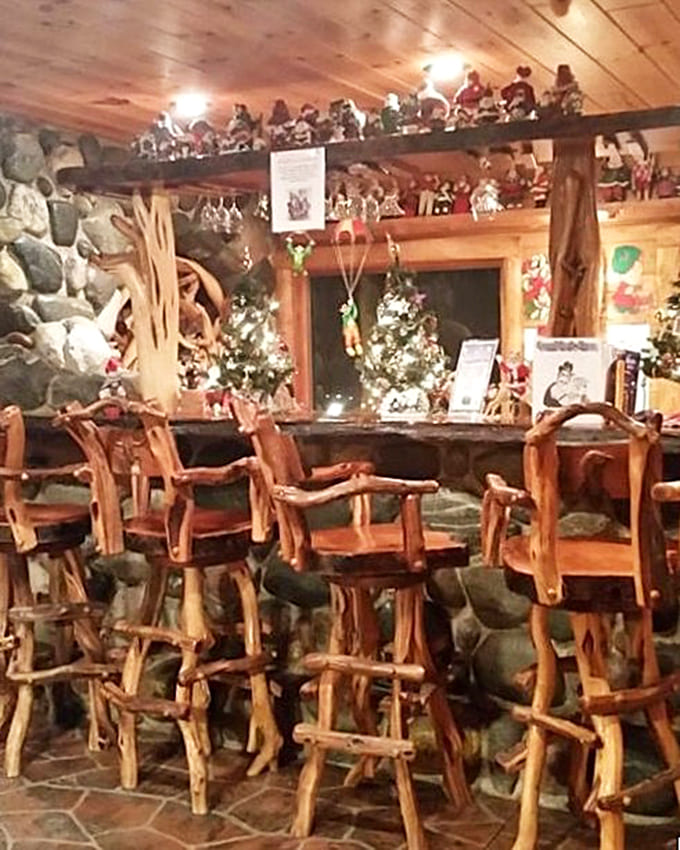 These rustic log bar stools aren't just seating—they're front-row tickets to the Christmas show happening on every shelf and surface.