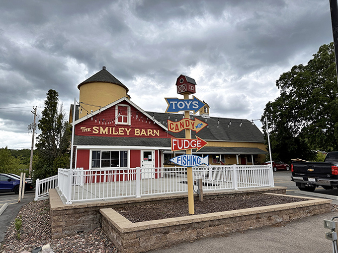 Store Exterior View: The barn's multi-colored directional signs point to joy in all forms &ndash; toys, candy, ice cream, and fishing tackle.