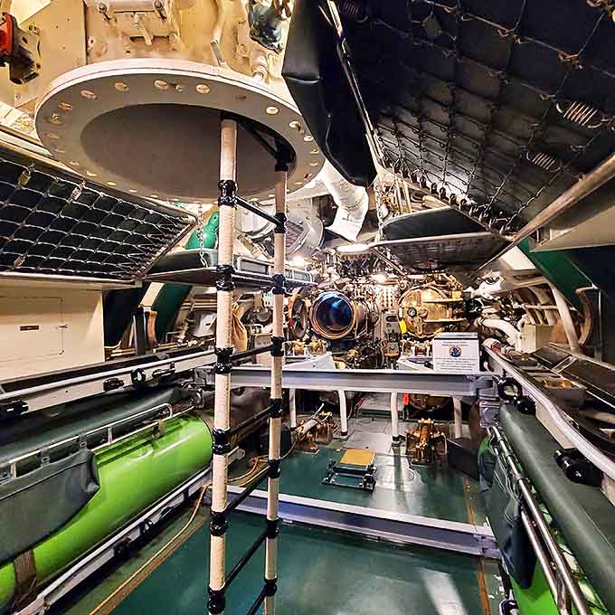 The torpedo room reveals the business end of submarine warfare, where sailors loaded the weapons that made the Cobia such an effective hunter.