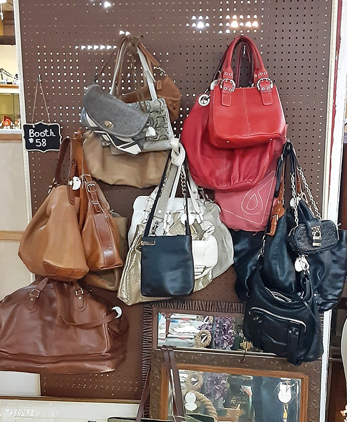 Vintage handbags hanging like ripe fruit &ndash; each one carried lipstick, secrets, and maybe a dance card in its previous life.