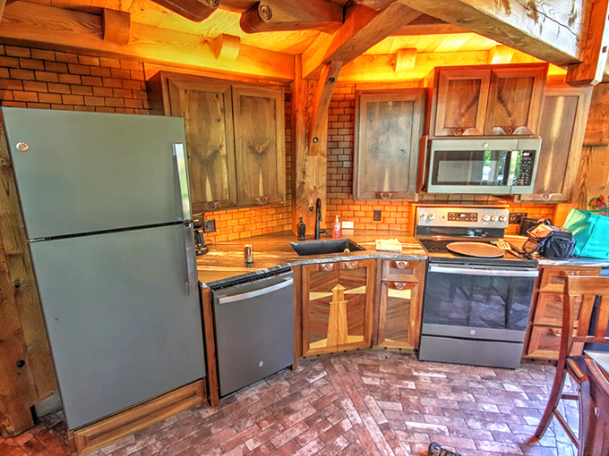 The kitchen blends rustic elements with modern convenience &ndash; whip up pancakes while surrounded by craftsman-quality woodwork.