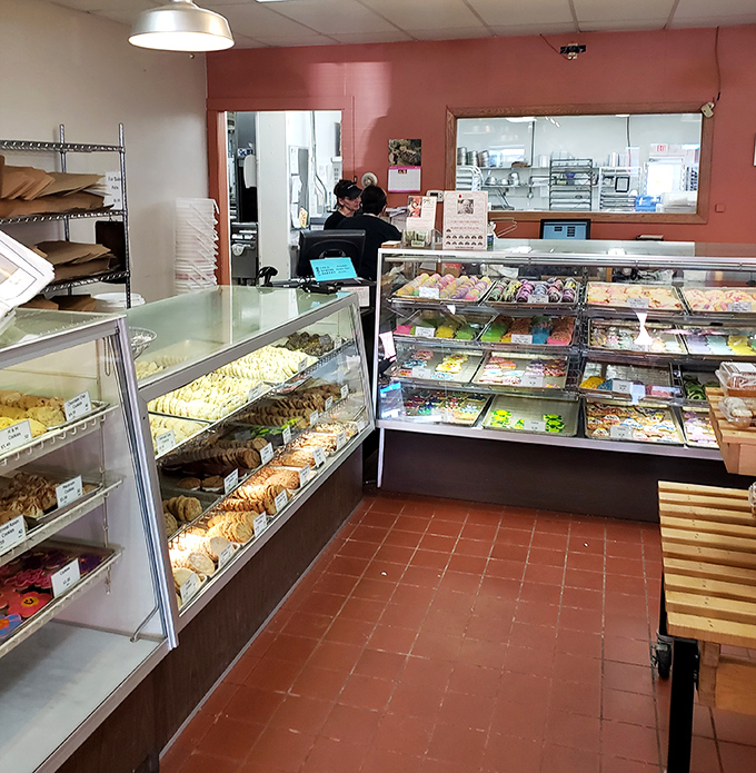 The order counter where friendly staff guide customers through the delicious dilemma of choosing just one treat.