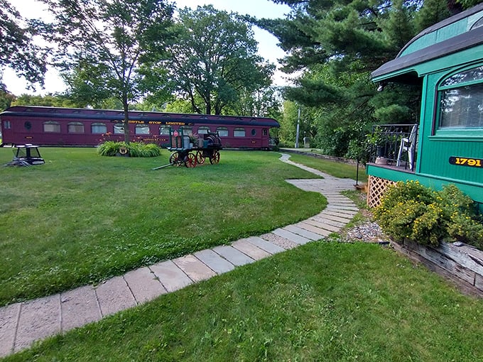 Pathways wind between vintage train cars, each one holding stories of thousands of miles traveled across America's expanding landscape.