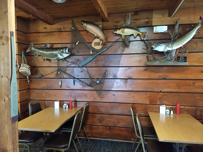 Mounted fish trophies watch over diners from wood-paneled walls, silently judging your decision to order something other than the catch of the day.