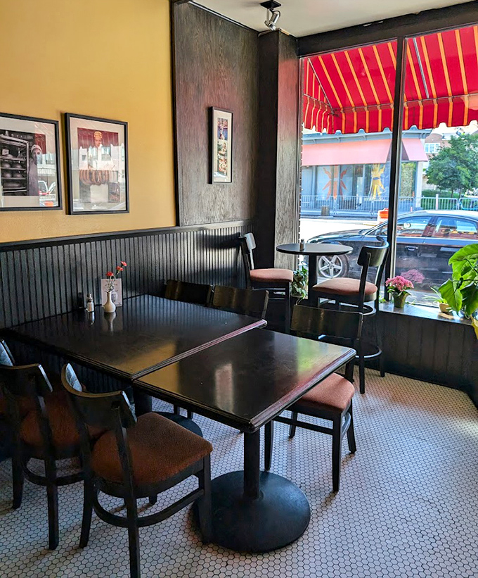 Cozy indoor seating at Kramarczuk's Sausage Co. in Minneapolis, perfect for lingering conversations, comfort food, and warm neighborhood vibes today.