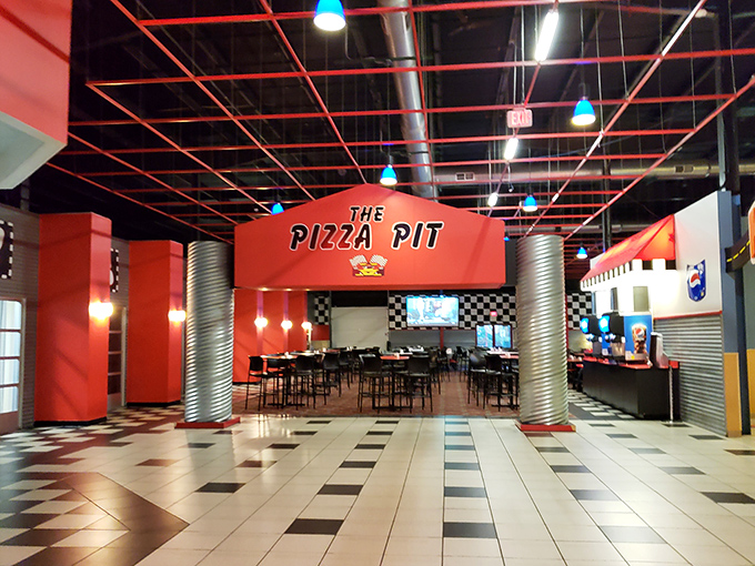 The pizza pit: The refueling station where hungry families gather to debate go-kart strategies over hot, cheesy slices that somehow taste better after conquering the arcade.