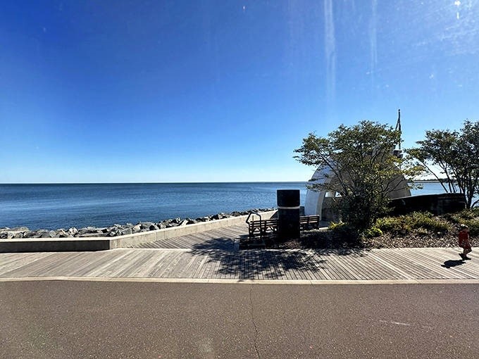 The shoreline unfolds like a living painting from your window seat, where Lake Superior's vastness meets Duluth's historic architecture.