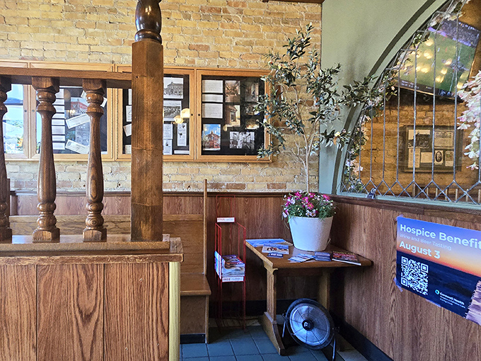 Warm wood paneling and exposed brick create a welcoming nook where anticipation builds and the aroma of comfort food teases your senses.