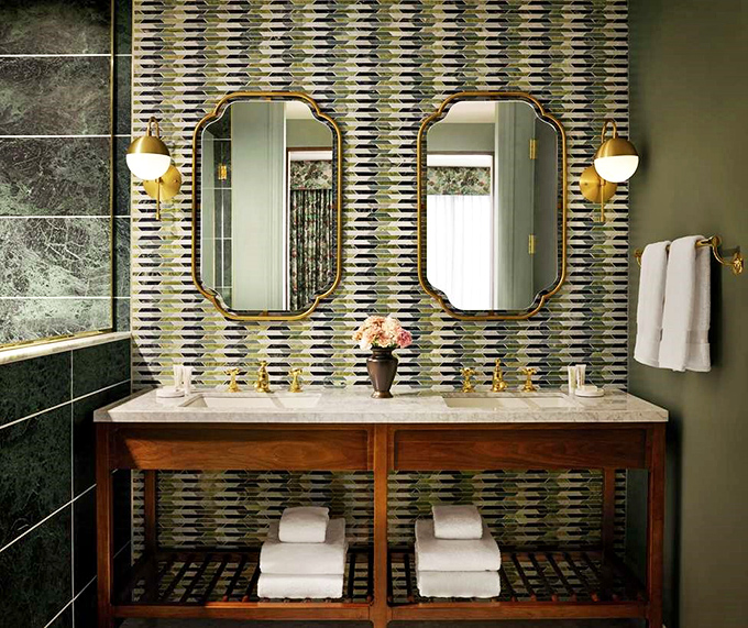 Bathroom design that makes you want to steal decorating ideas &ndash; geometric tiles and brass fixtures create unexpected luxury.
