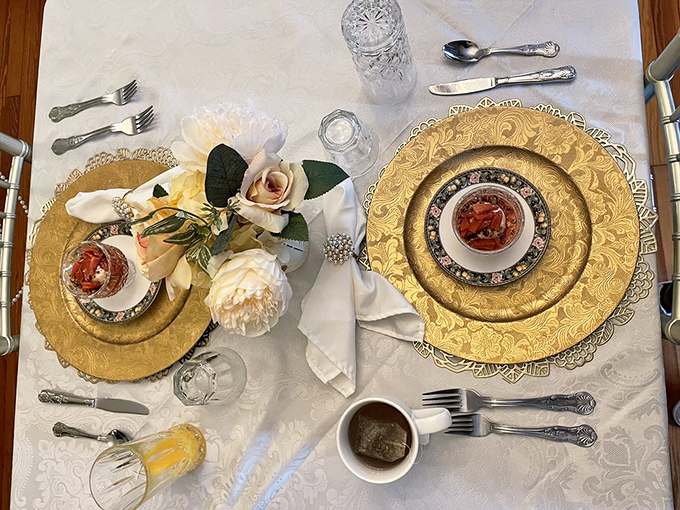 Breakfast transforms into art with gold chargers, fine china, and fresh flowers &ndash; morning fuel presented with Victorian flair.