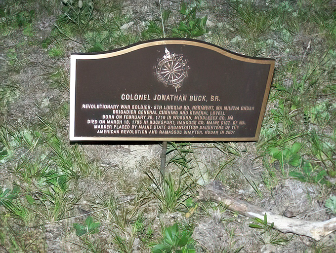 This commemorative plaque honors Colonel Buck's Revolutionary War service, a historical fact often overshadowed by the more colorful witch legend.