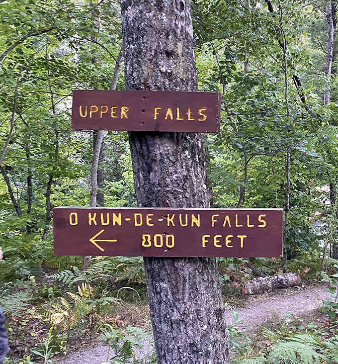 Trail signs point the way to adventure &ndash; these rustic markers have guided generations of hikers to O Kun-de-kun's hidden beauty.