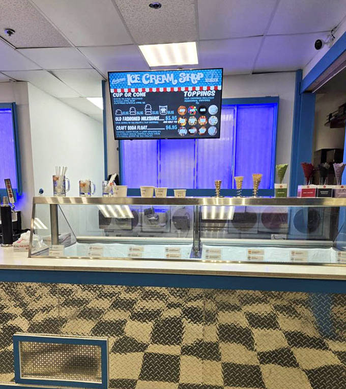 The ice cream counter gleams with promise, a cool oasis in a desert of sweet temptations that beckons with creamy possibilities.