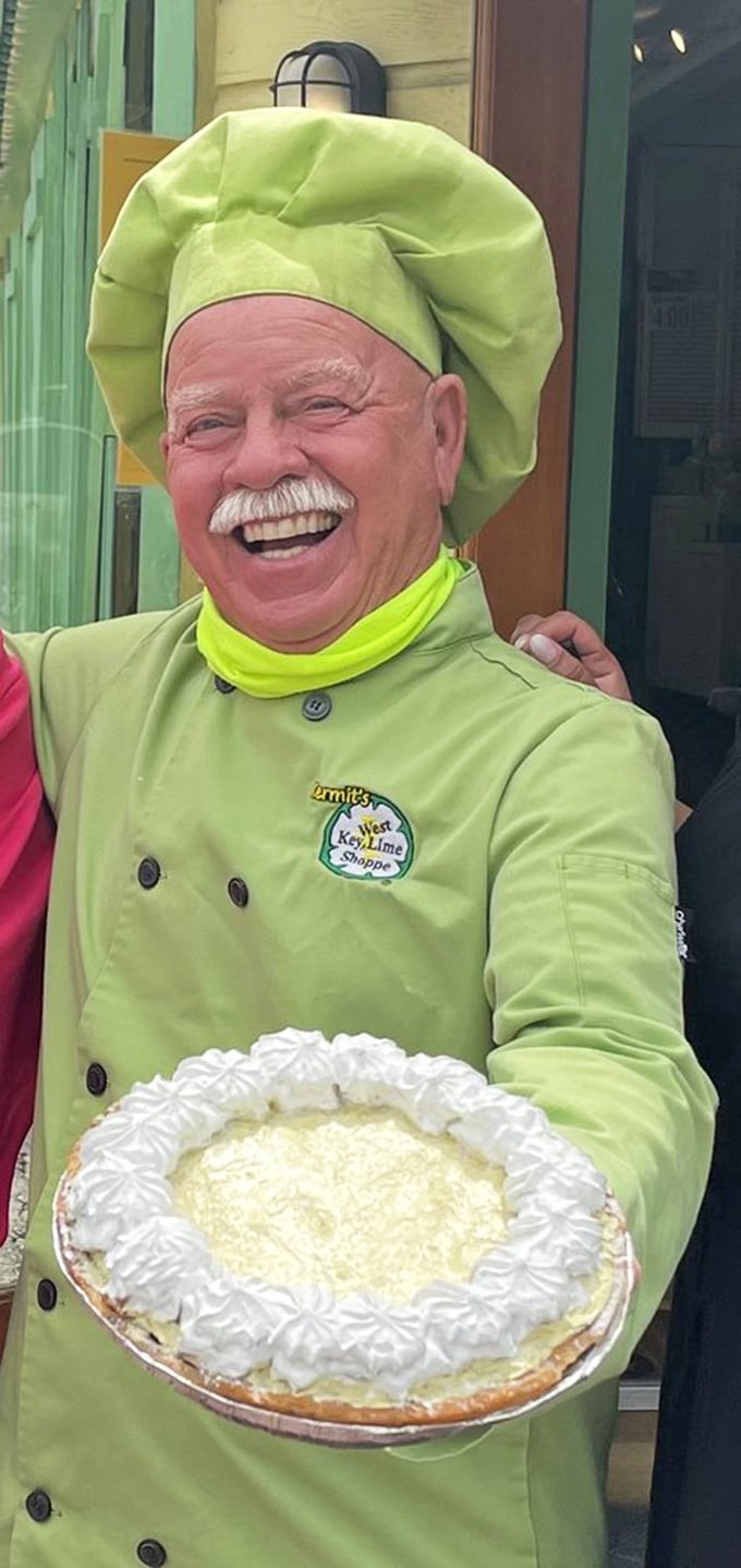 The passion behind the pie &ndash; a chef in vibrant lime-green proudly displaying the creation that put Key West on the dessert map.