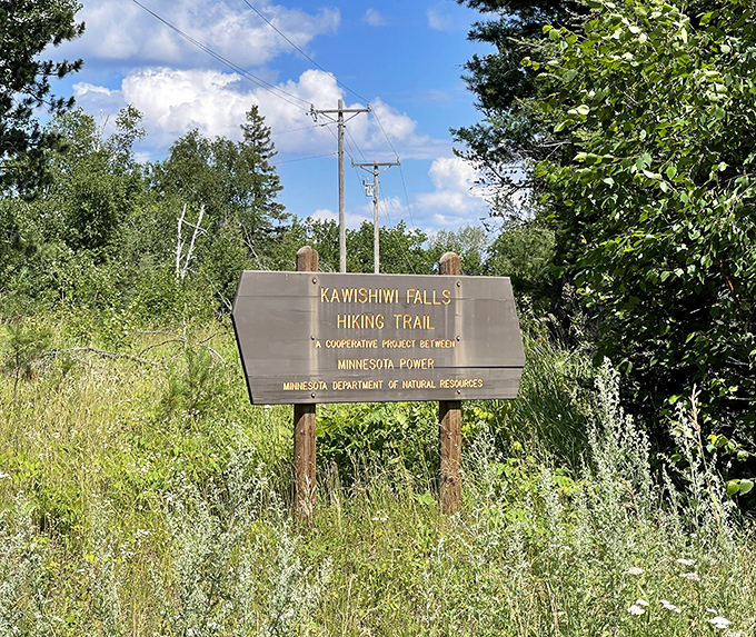 The welcoming trail sign marks the beginning of your adventure, no password or secret handshake required.