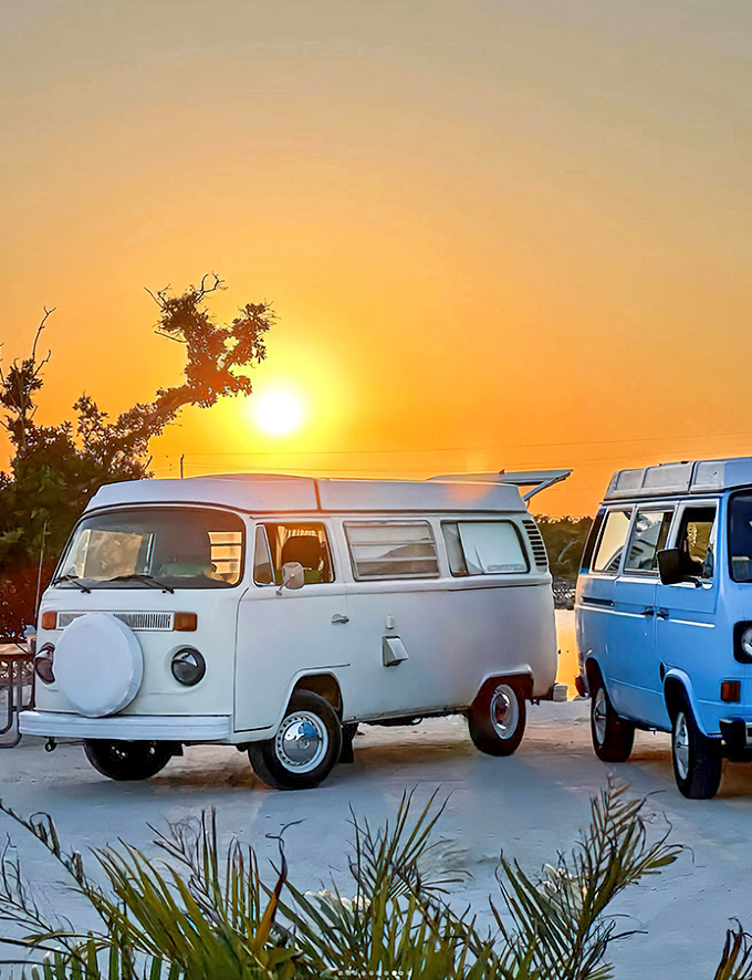 Golden hour transforms these vintage VWs into silhouettes against a watercolor sky &ndash; the perfect ending to another day in paradise.