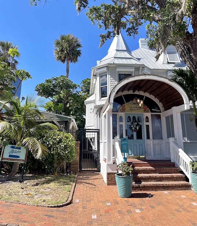 The exterior shows off classic Queen Anne architecture with that distinctive turret, surrounded by palms and Florida sunshine, making you wonder why you don't eat here more often.