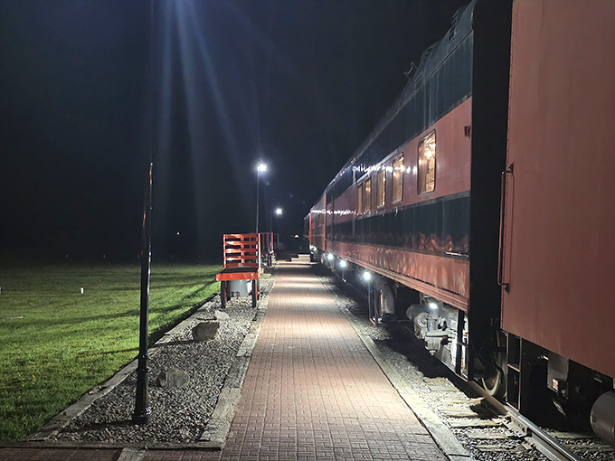Evening's embrace transforms the train into a ribbon of light cutting through Wisconsin's darkness.