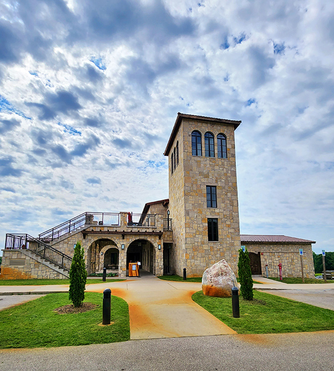 The iconic tower stands as a beacon for wine lovers, its stone construction and thoughtful design elements signaling the extraordinary experience that awaits inside.