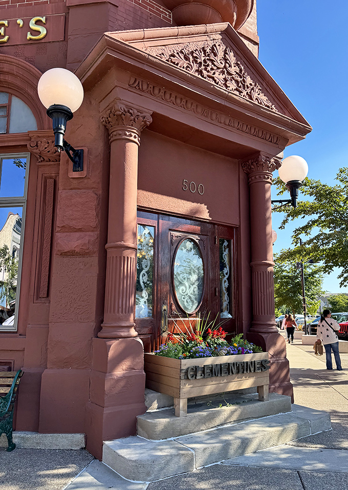 Elegant columns frame the entrance like sentinels guarding a culinary treasure, while decorative stonework showcases craftsmanship from another era.