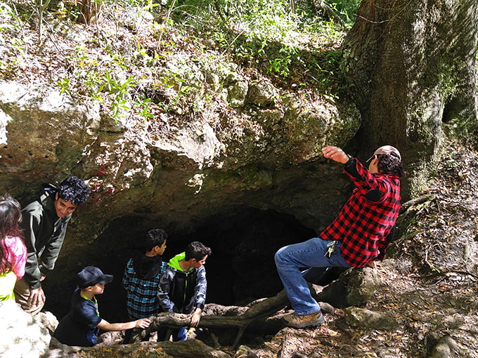 Family expedition: Young explorers tackle the cave entrance with the fearless enthusiasm that only childhood provides.