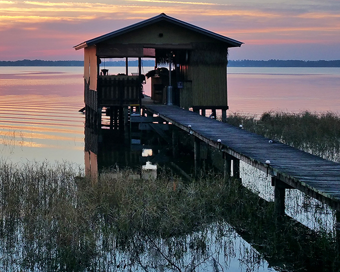 Sunset transforms a simple boathouse into a silhouette worthy of a postcard &ndash; Florida magic at its most authentic.