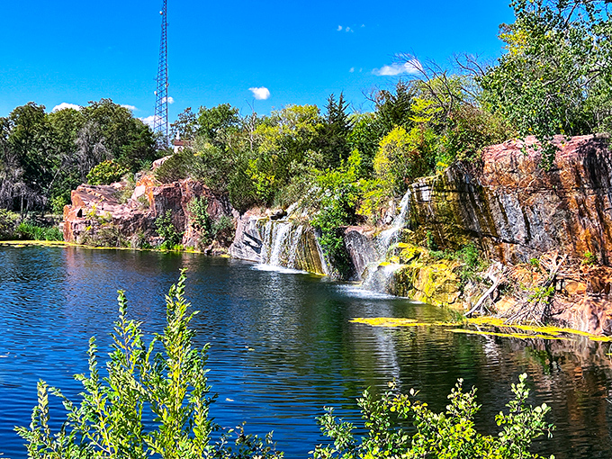Sunlight dances across multiple cascades, creating a scene so perfectly Wisconsin it practically screams "take my picture" to passing visitors.