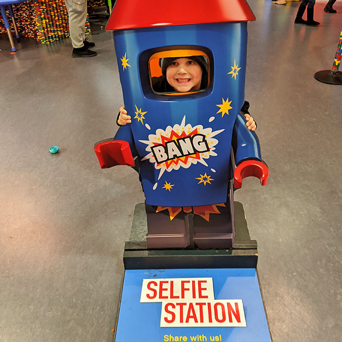 "I'm a human-sized LEGO rocket!" The selfie station transforms visitors into shareable social media content with plastic panache.