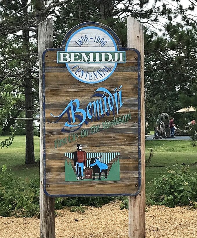 This vintage sign celebrates Bemidji's centennial, featuring the iconic duo that has become synonymous with Minnesota's north woods.
