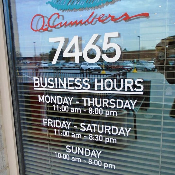 Business hours posted clearly &ndash; because knowing when you can return for your next feast is essential information for Q. Cumbers enthusiasts.