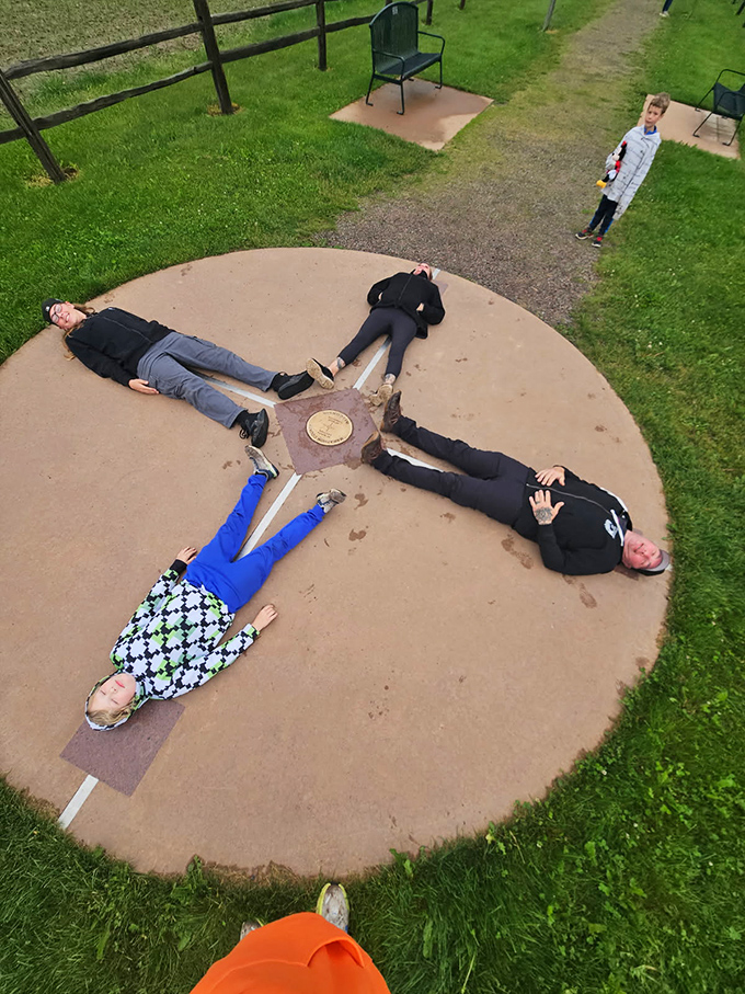 Four people, four directions, one perfect mathematical moment captured in a field in central Wisconsin.