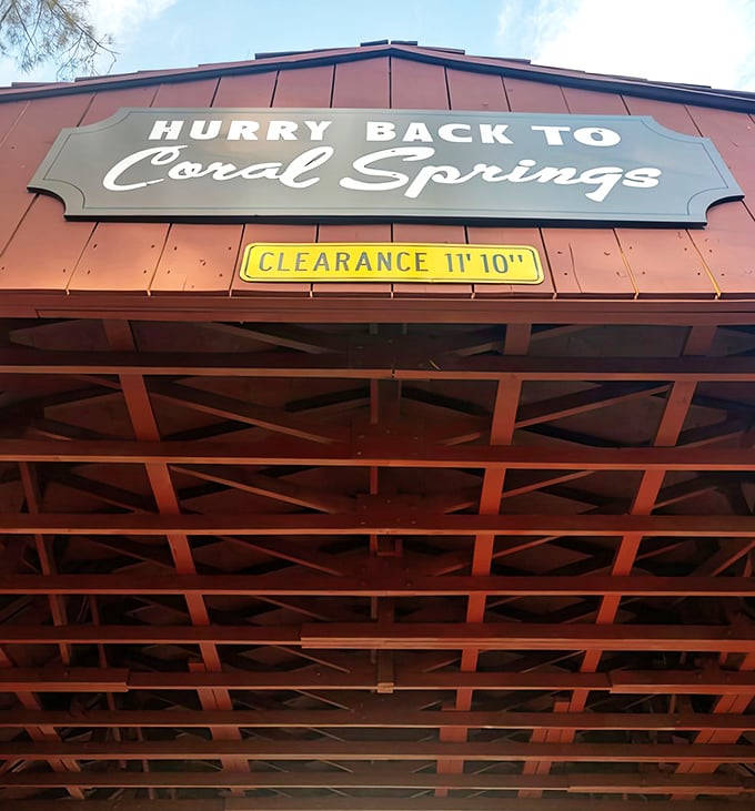 The "Clearance 11'10"" sign reminds visitors that this isn't your typical Florida overpass – it's a carefully preserved piece of Americana.