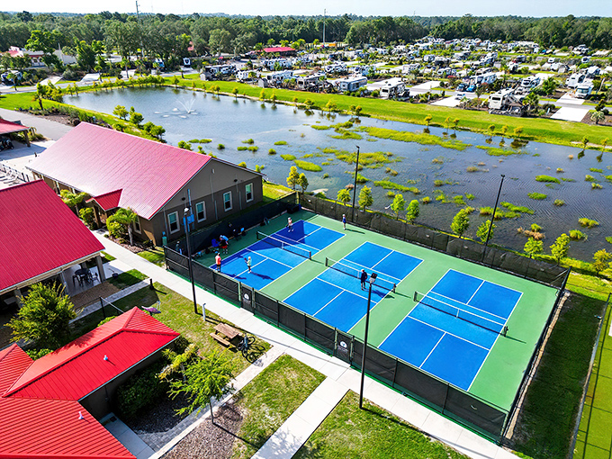 Bird's-eye brilliance: pickleball courts and the resort pond create a recreational paradise surrounded by a community of happy campers.