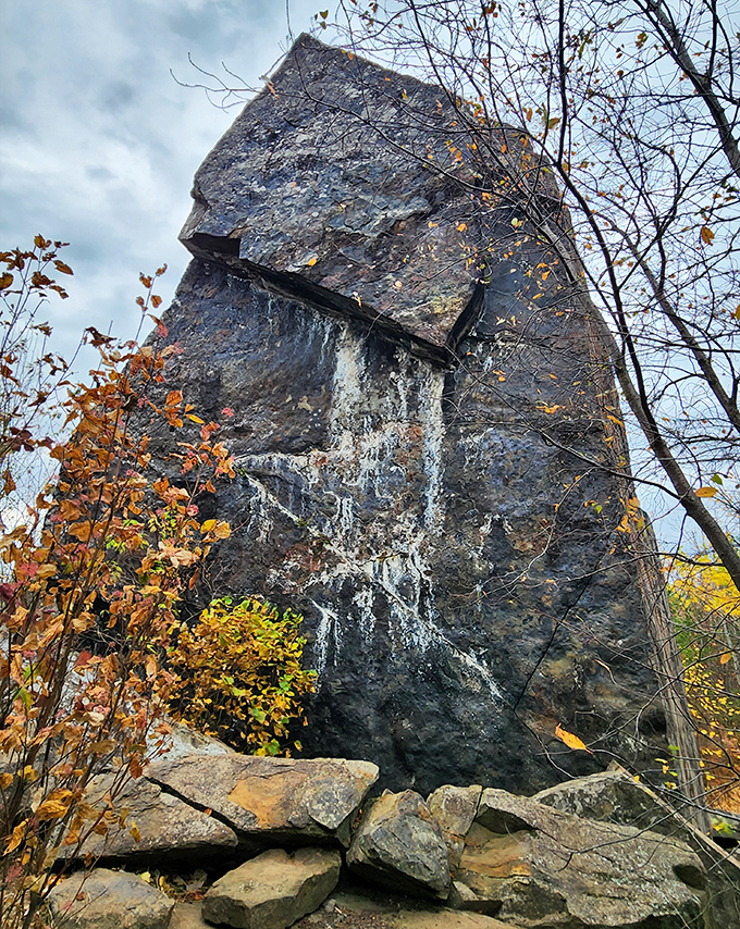 Framed by autumn's golden touch, the rock reveals different personalities depending on your perspective and the season's mood.