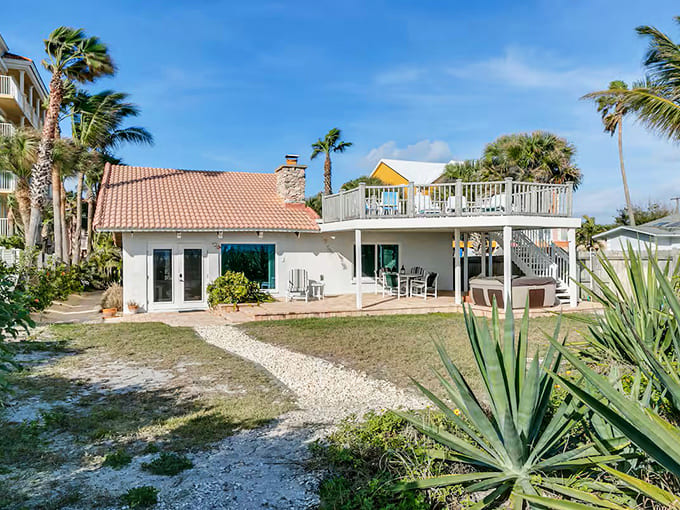 This oceanfront property sits right where the beach meets your backyard, making "going to the beach" a five-second commute.