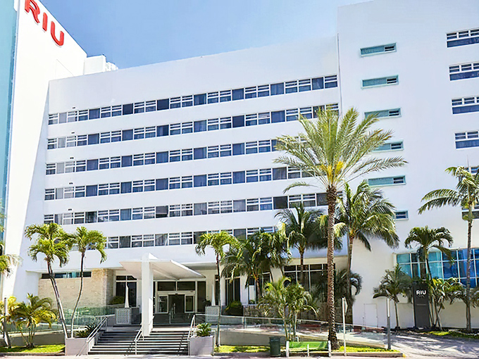 The Hotel Riu Plaza stands like a white monument to vacation indulgence, housing one of Miami Beach's most impressive buffet experiences within its stylish walls.